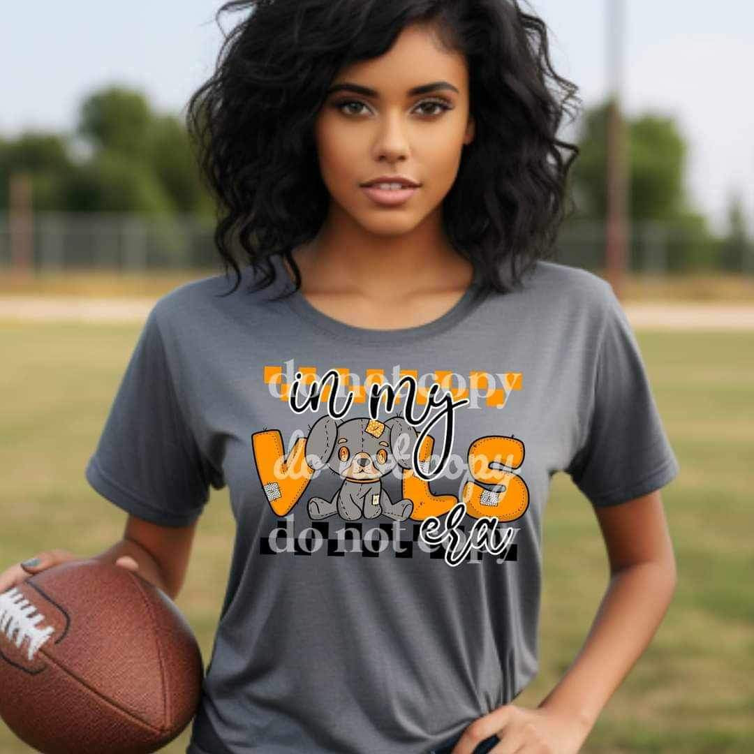In my vols era (black and orange font with stuffed puppy) 15096 DTF Tr ...
